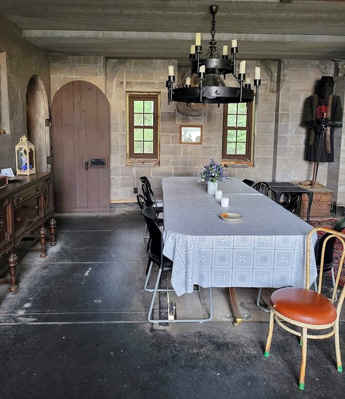 Dinner is served in true castle fashion, where the stone walls and wrought-iron chandelier make even a simple meal feel like a royal feast. Eating pizza here would feel downright majestic. 