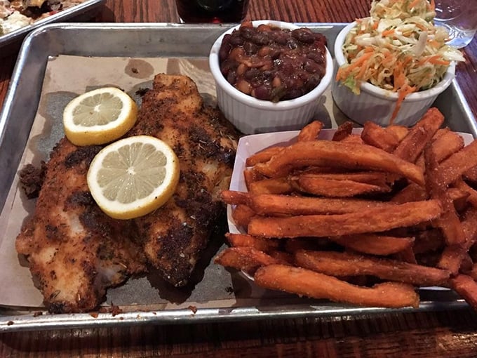 Blackened catfish with bright lemon, sweet potato fries, and sides that don't know they're supposed to be supporting actors. Everyone's a star here.