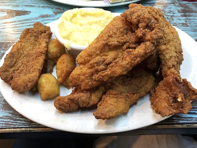 Crispy catfish that would make Huckleberry Finn settle down and start a restaurant. Paired with creamy mashed potatoes, it's a Southern river's bounty done right.