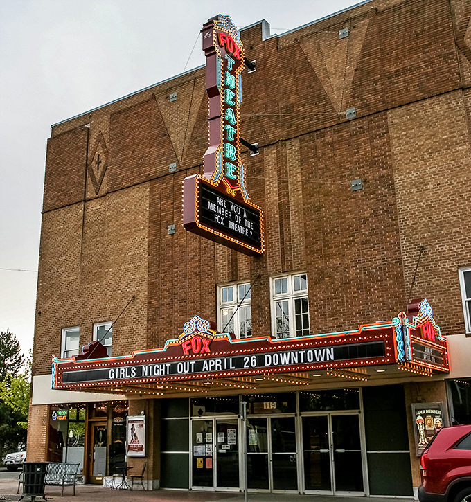 The Fox Theatre's neon marquee glows with vintage glamour, a beacon of entertainment that's been drawing crowds since the days when movies cost a quarter.