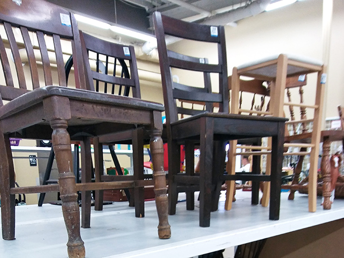 Chairs with character await their second act. That wooden one has definitely seen some family dinners and probably a few holiday arguments. 