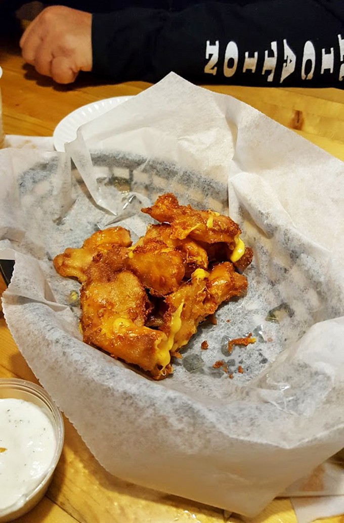 Wisconsin's unofficial state food in its natural habitat &ndash; golden-fried cheese curds that squeak between your teeth and make your soul sing.