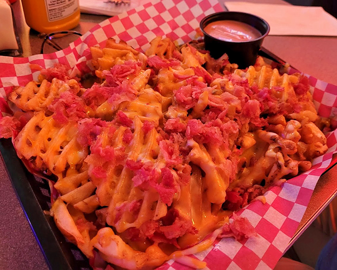 These cheese fries aren't messing around&mdash;loaded with bacon bits and melted cheese, they're the kind of indulgence that makes you temporarily forget vegetables exist.