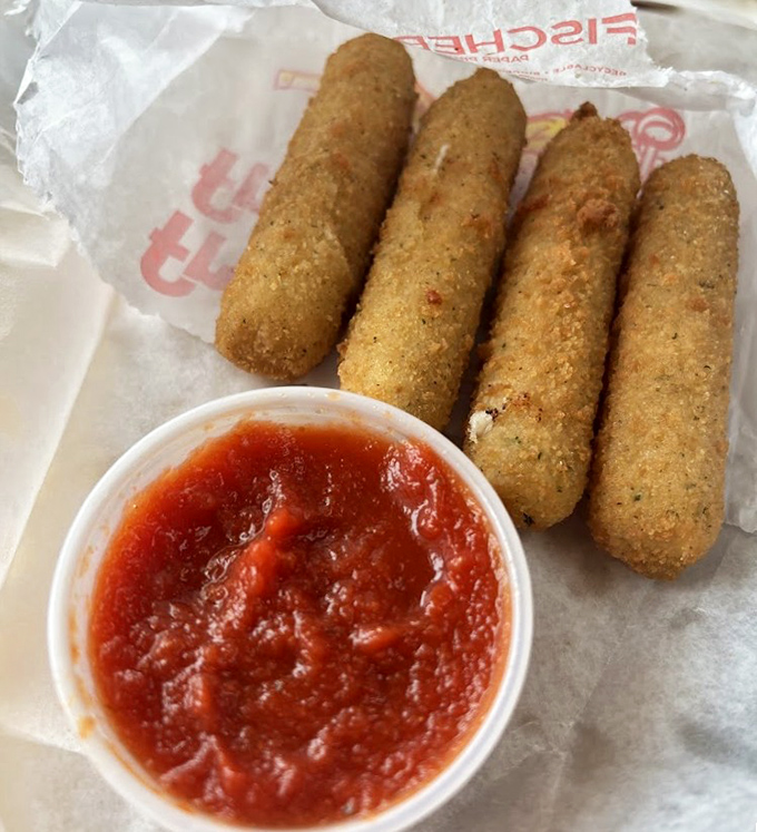 Golden-fried mozzarella sticks with marinara—because sometimes you need a crispy, gooey prelude to the main hot dog event.