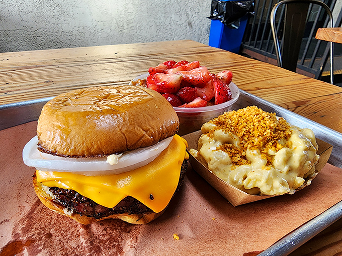 This isn't just a burger; it's a life-affirming experience with melted cheese, a toasted bun, and sides that refuse to be mere afterthoughts.