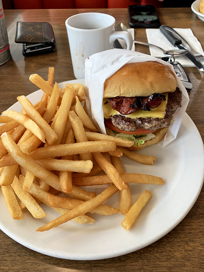 This isn't just a burger&mdash;it's architecture with beef, where every layer from the melted cheese to the toasted bun plays its essential, mouthwatering role.