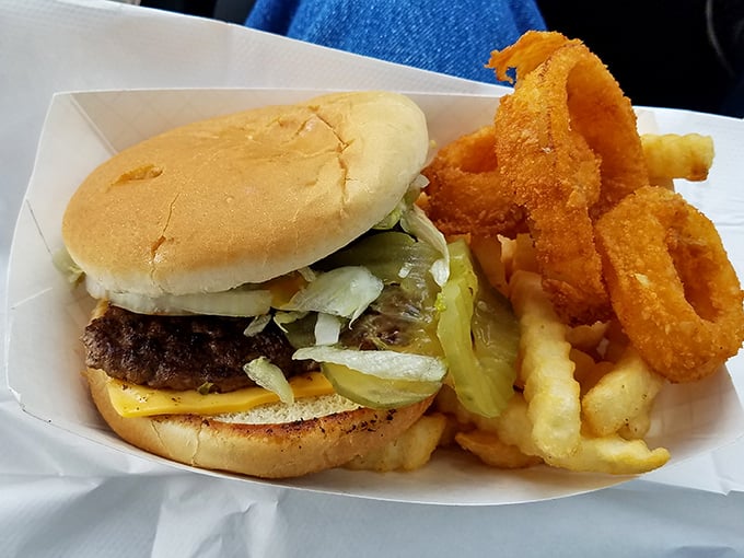 The cheeseburger and onion rings combo&mdash;proof that sometimes the simplest pleasures are the most profound. This isn't just lunch; it's edible happiness.