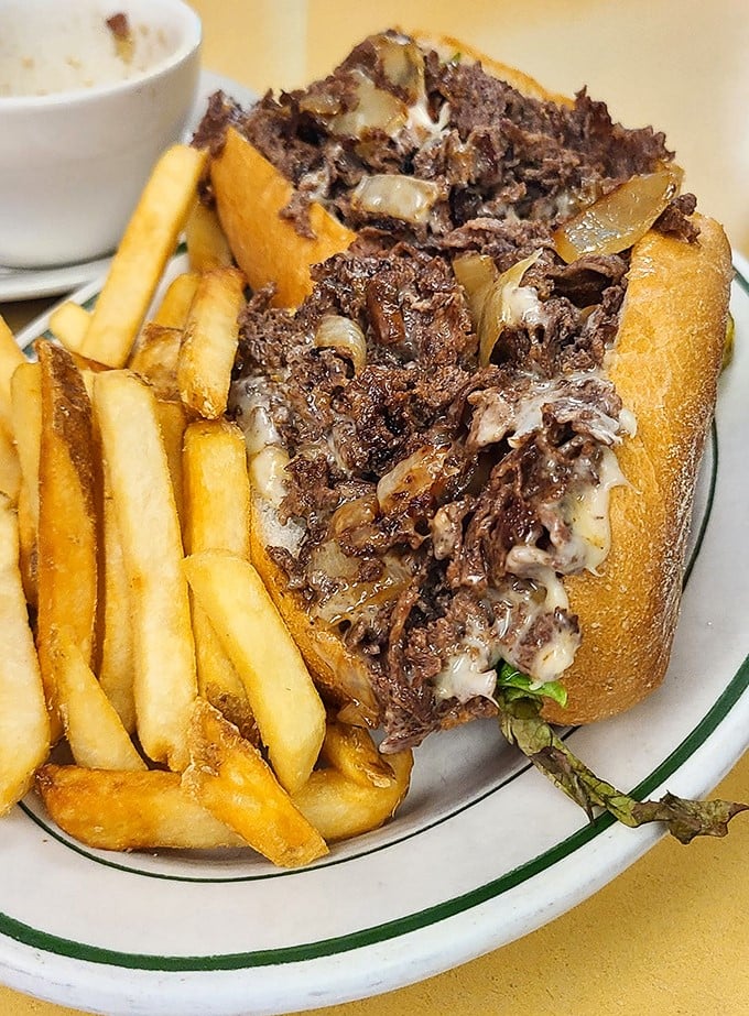 This isn't just a cheesesteak &ndash; it's a Pennsylvania handshake on a roll. Tender beef, melted cheese, and fries that deserve their own fan club.
