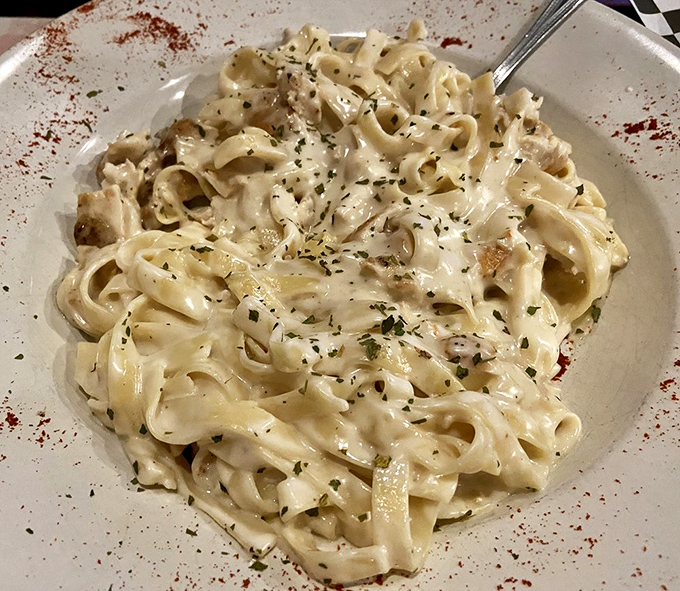 Creamy Alfredo coating every ribbon of fettuccine is the kind of indulgence that makes dieting feel very overrated.