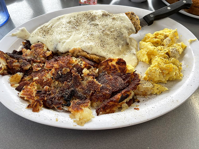 Chicken fried steak smothered in gravy – where comfort food meets cardiac concern, but your taste buds vote unanimously to proceed anyway.