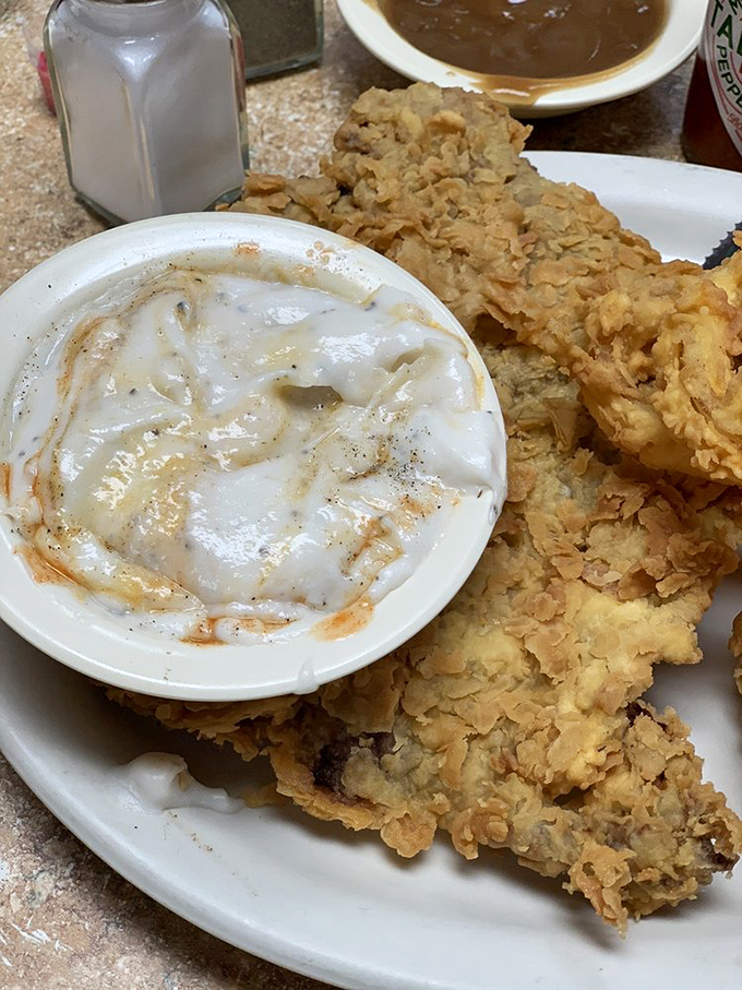 Chicken fried steak so generous, your cardiologist might send you a concerned text.