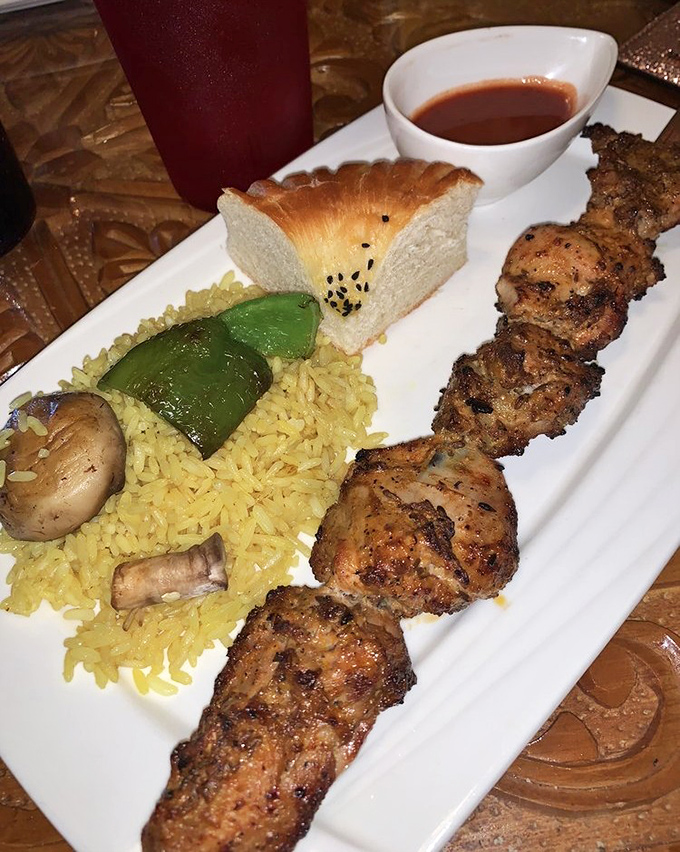 Chicken kebab that's had a proper introduction to fire—juicy, charred in all the right places, and served with rice that's anything but an afterthought.