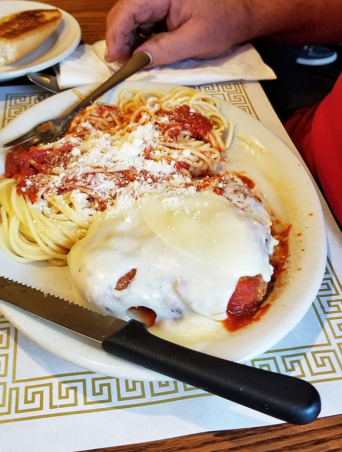 Their chicken parmesan doesn't care about your beach body plans—it's comfort wrapped in cheese, smothered in sauce, and worth every napkin.