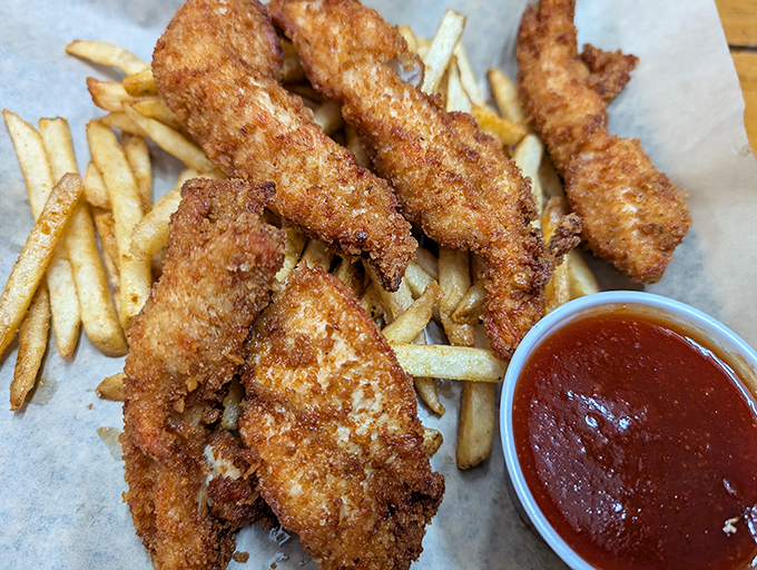 Golden chicken tenders that could make Colonel Sanders question his life choices &ndash; crispy perfection awaits.