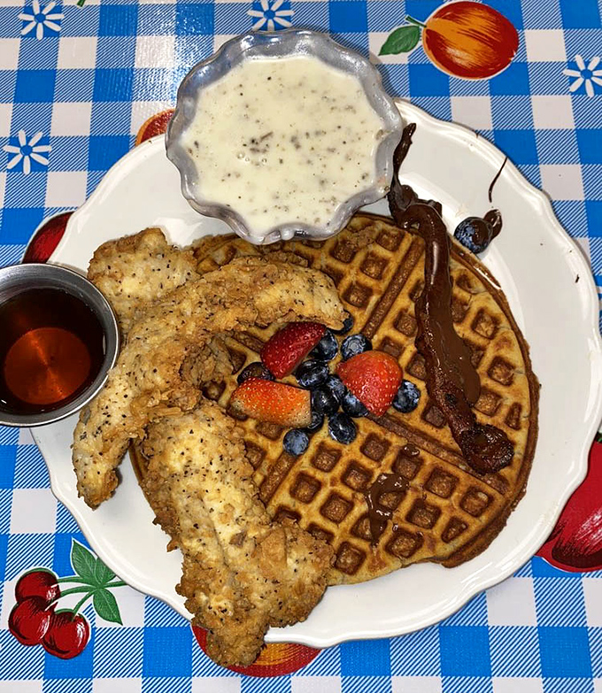 Chicken and waffles with bacon and berries is the kind of plate that makes you understand why breakfast is controversial.