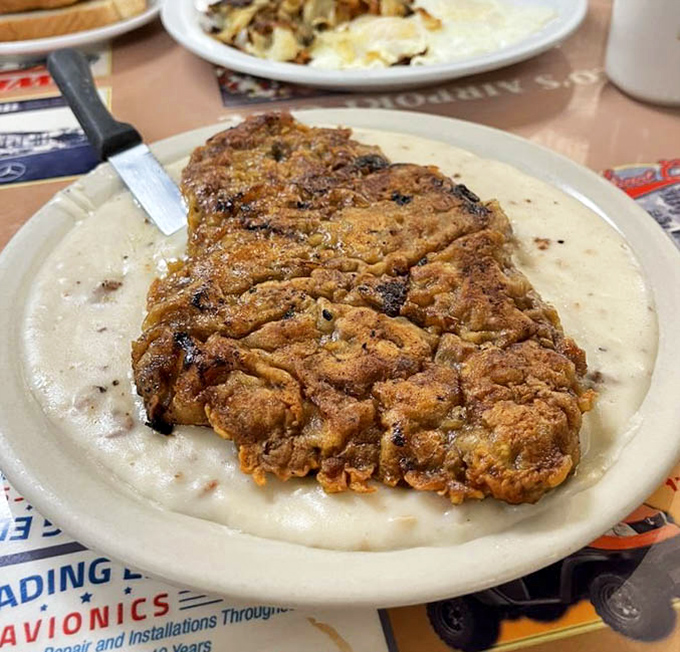 This chicken fried steak doesn't just cover the plate&mdash;it conquers it. The gravy-to-meat ratio would make Southern grandmothers nod in approval.