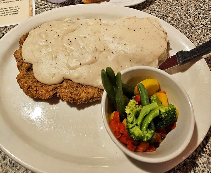 Country-fried steak swimming in peppery gravy&mdash;the kind of dish that makes you want to hug the cook and thank your cardiologist for understanding your occasional indiscretions.