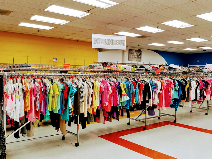 The children's section bursts with color like a rainbow decided to become a clothing store overnight.