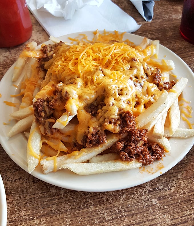 Chili cheese fries that laugh in the face of diet culture&mdash;a glorious mountain of comfort that's worth every napkin you'll need.