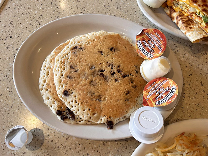 Chocolate chips scattered across a fluffy pancake the size of your head&mdash;breakfast dreams really do come true here.