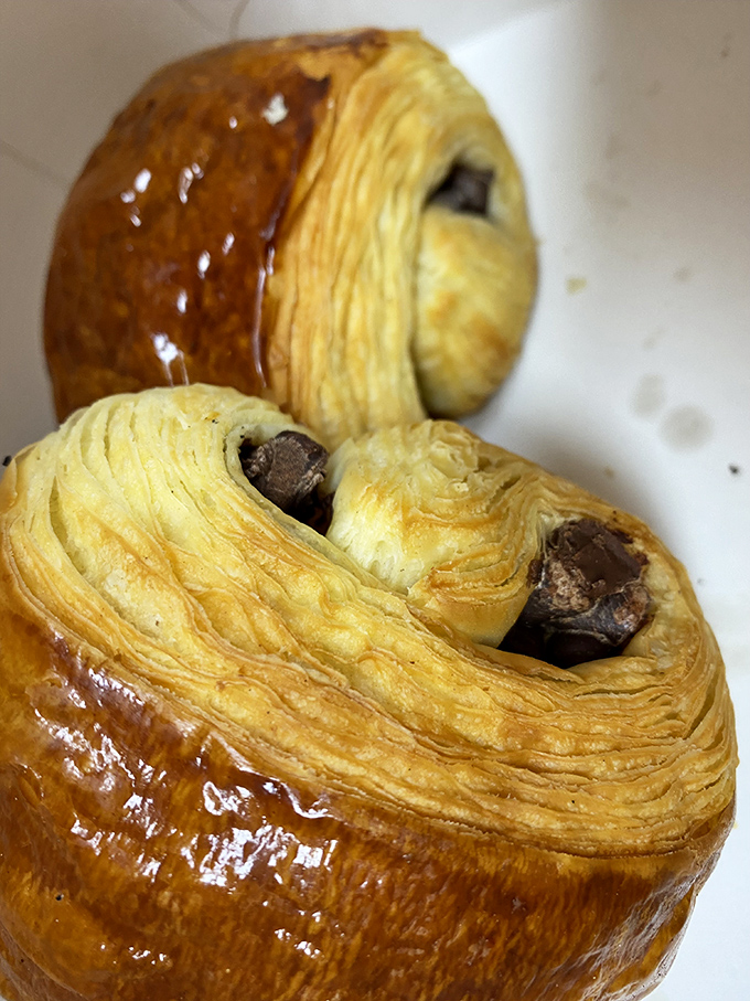 Layers upon layers of buttery perfection with chocolate hiding inside like buried treasure. Croissants this good make Monday mornings bearable.