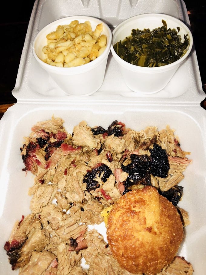 The holy trinity of Southern comfort: pulled pork, mac and cheese, and collard greens. Add a corn muffin for the full gospel.