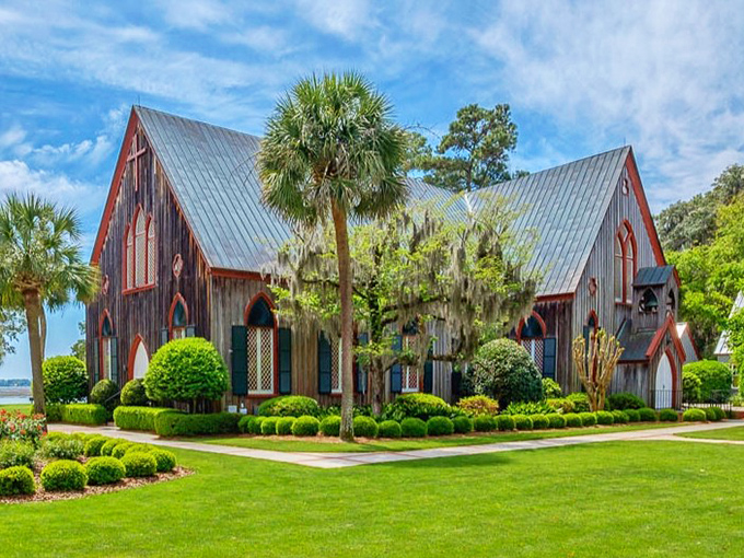 Church of the Cross stands like a rustic sentinel overlooking the May River. Gothic architecture meets Lowcountry charm in this weathered wooden sanctuary.