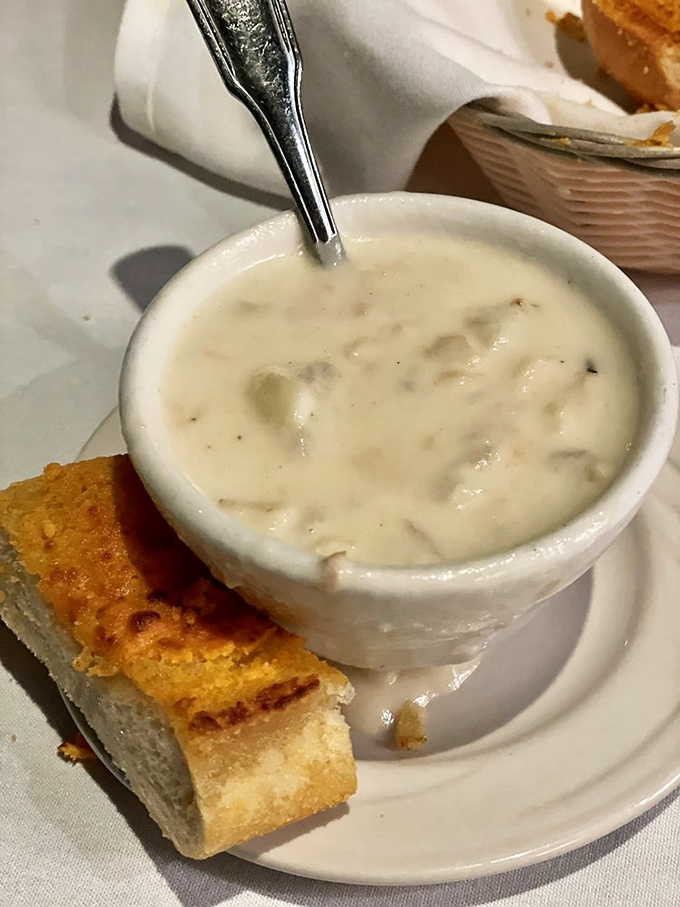 This isn't just clam chowder&mdash;it's a creamy ocean symphony in a cup, with garlic bread standing by for the essential final dip.