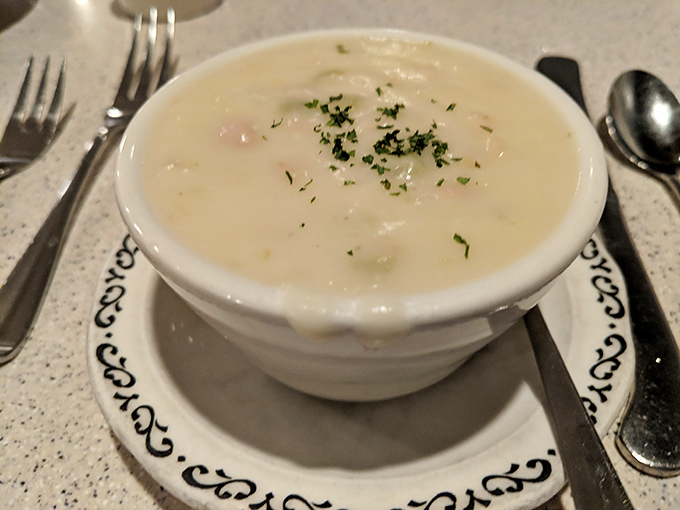Creamy clam chowder that whispers "comfort" with every spoonful. The sprinkle of fresh herbs adds that perfect touch of color and flavor to this soul-warming classic.