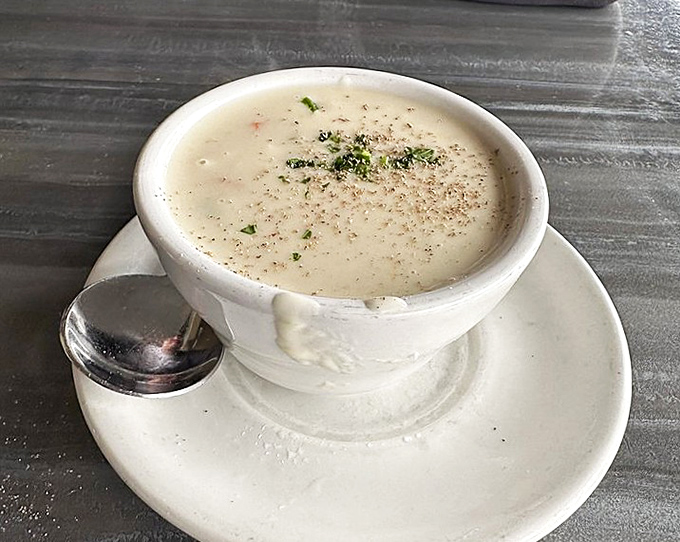 Clam chowder so velvety smooth it could teach master classes in comfort food. The spoon is merely a delivery system for bliss.