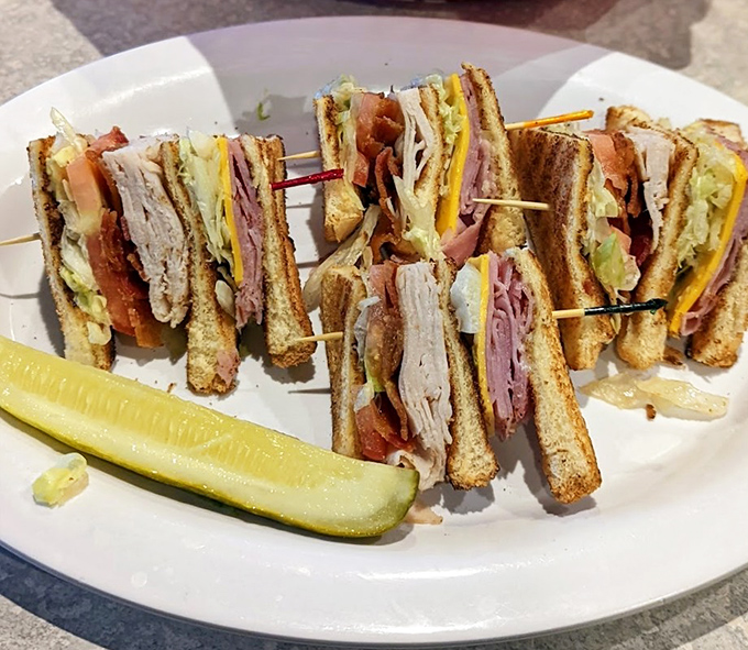 The club sandwich: architectural marvel of the culinary world. Stacked higher than your weekend to-do list and twice as satisfying.