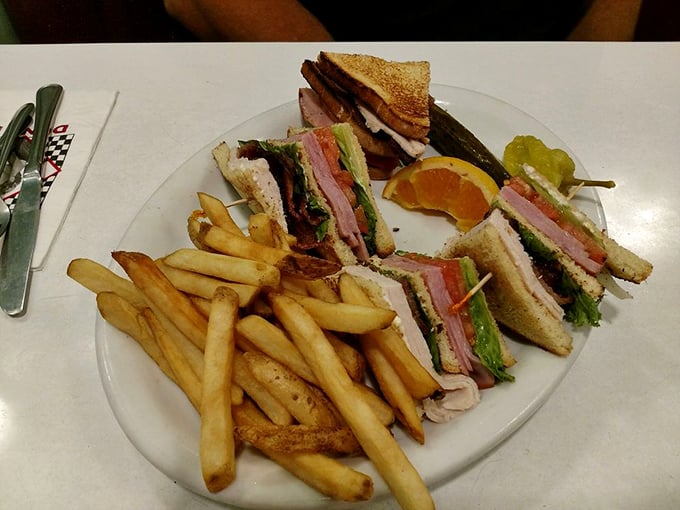 A club sandwich that stands tall and proud, like a delicious skyscraper of turkey, bacon, and toast that requires a game plan to eat.