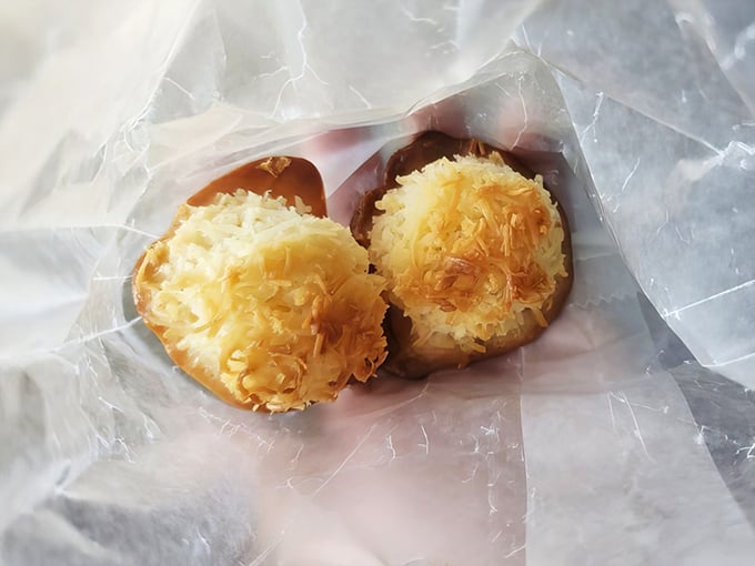 Golden-topped coconut macaroons nestled in wax paper &ndash; little haystacks of happiness that somehow improve any day by at least 37%.