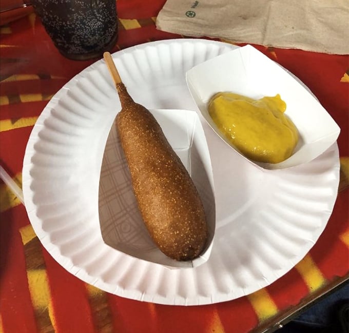 The corn dog: nostalgia on a stick, perfectly fried to that golden-brown crunch that transports you straight back to childhood.