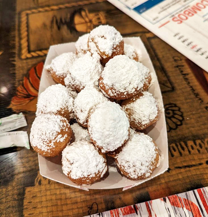 Those famous corn fritters dusted with powdered sugar &ndash; sweet preludes to seafood that have sparked family feuds over the last one.