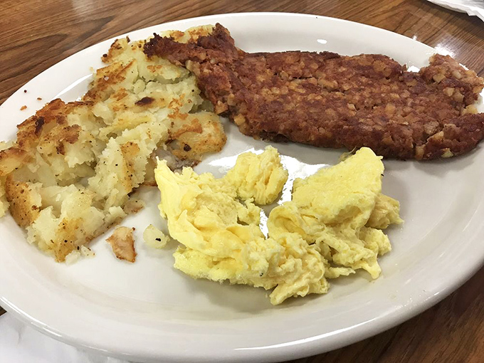 Country fried steak with eggs and potatoes: the breakfast equivalent of a warm hug from your favorite aunt who doesn't care about your cholesterol levels.