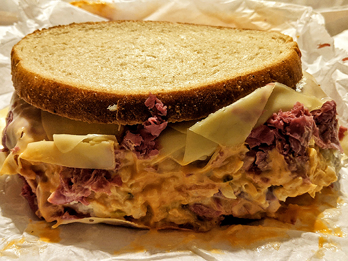 Sandwich architecture at its finest. This corned beef creation doesn't just satisfy hunger &ndash; it redefines what bread and meat can accomplish together.