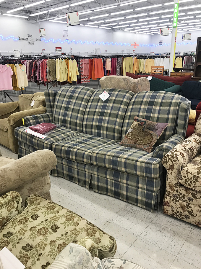 The couch section: where plaid and floral patterns live in peaceful harmony. That blue wave lighting adds a touch of disco to domestic bliss.