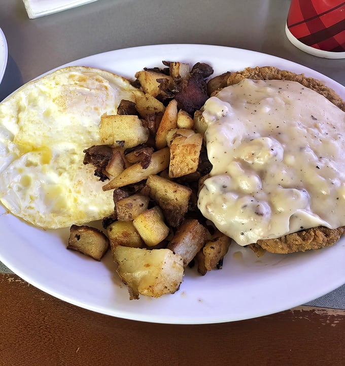 Eggs, potatoes, and a biscuit smothered in that legendary gravy&mdash;a breakfast trinity so perfect it should have its own holiday.