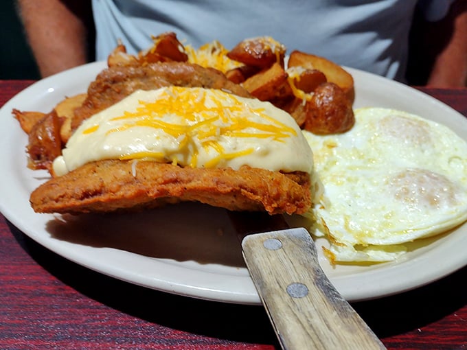 Country fried steak smothered in gravy with eggs sunny-side up&mdash;the breakfast of champions who plan to nap immediately afterward.