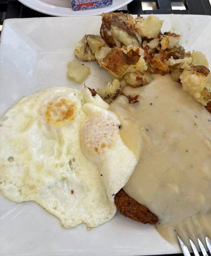 Country fried steak smothered in gravy &ndash; because sometimes your arteries deserve a vacation too.