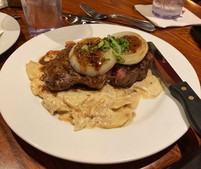 The Cowboy Steak doesn't just sit on the plate&mdash;it commands it, with those grilled onions standing at attention like loyal deputies.