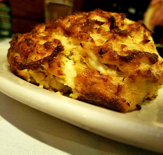 The holy grail of Maryland cuisine: a crab cake with so much lump meat, it barely holds together until it meets your eager fork.