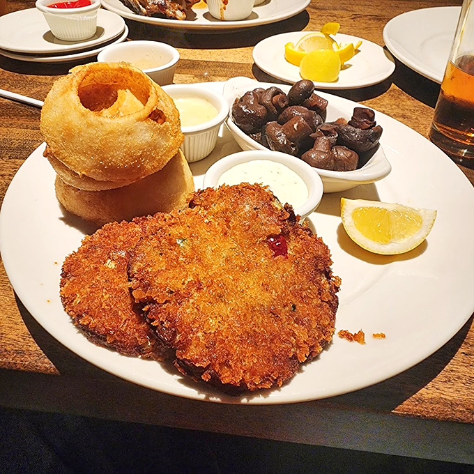 The crab cake &ndash; golden-crisp exterior giving way to sweet, tender crabmeat. Whoever said "good things come in small packages" clearly ate here.