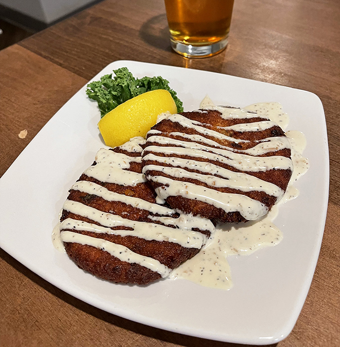 Golden-fried perfection drizzled with a sauce that should be illegal in at least seven states. These crab cakes aren't just a dish&mdash;they're an event.