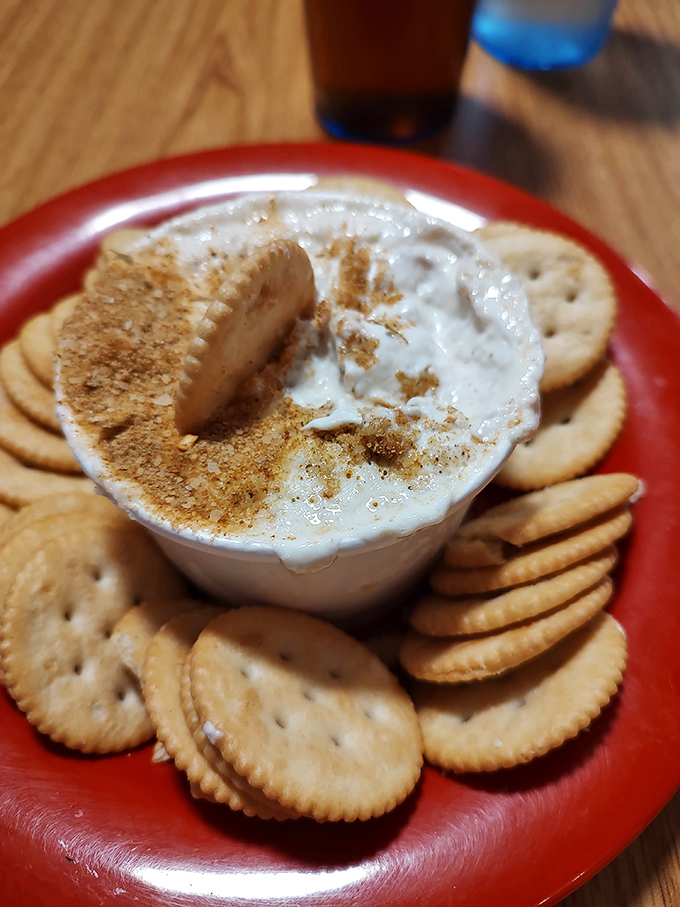Crab dip surrounded by a moat of crackers&mdash;a diplomatic solution ensuring every bite gets its fair share of creamy, seasoned goodness. Democracy never tasted so good.