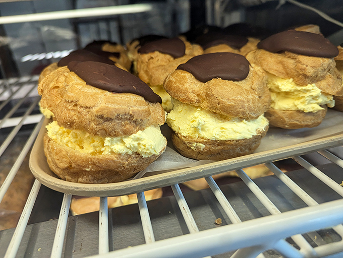 Cream puffs with chocolate tops—where pastry meets destiny. These little miracles prove that sometimes the best things in life really do fit in the palm of your hand.