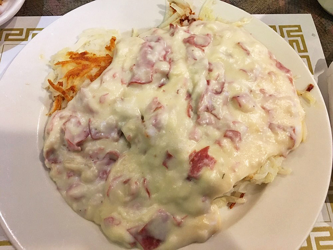 Creamed chipped beef blankets those hash browns like a warm Pennsylvania snowfall &ndash; comfort food that hugs you from the inside.