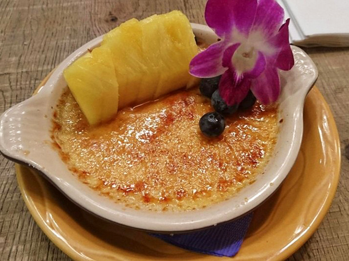 Cr&egrave;me br&ucirc;l&eacute;e with a crackling top that makes a more satisfying sound than bubble wrap, crowned with a slice of pineapple that tastes like Hawaii itself.