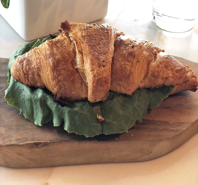 A croissant so perfectly golden and flaky, it deserves its own French passport and possibly a small art exhibition dedicated to its curves.